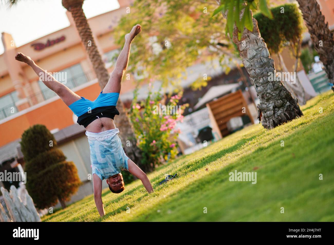 Standing upside down man at egyptian resort. I wait for this vacation ...