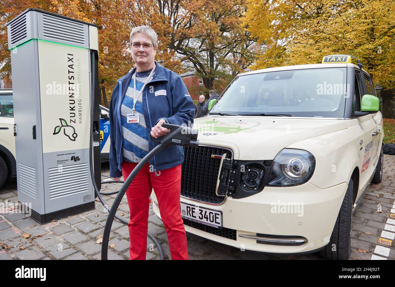 Hamburg, Germany. 03rd Nov, 2021. Birgit Neumann, taxi driver, stands ...
