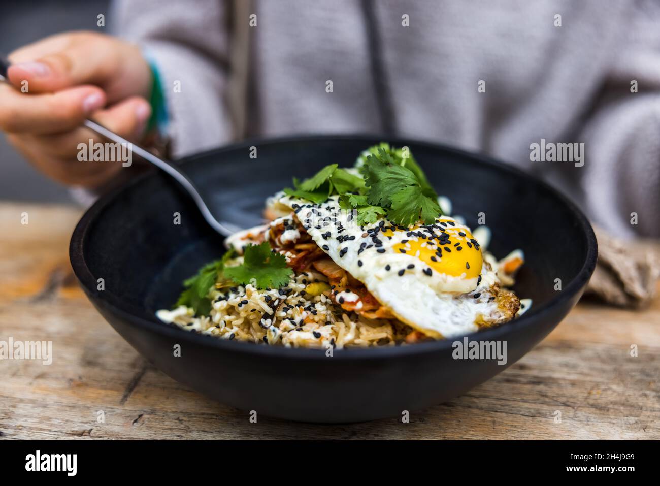 Human eating delicious fried eggs with rice Stock Photo - Alamy