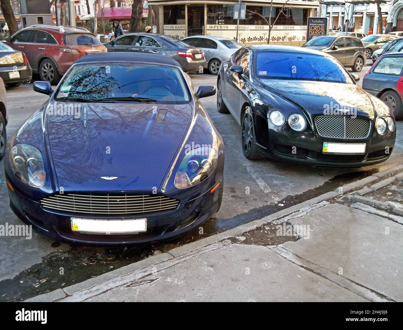 Kiev, Ukraine - March 7, 2011: Bentley Continental GT and Aston Martin ...