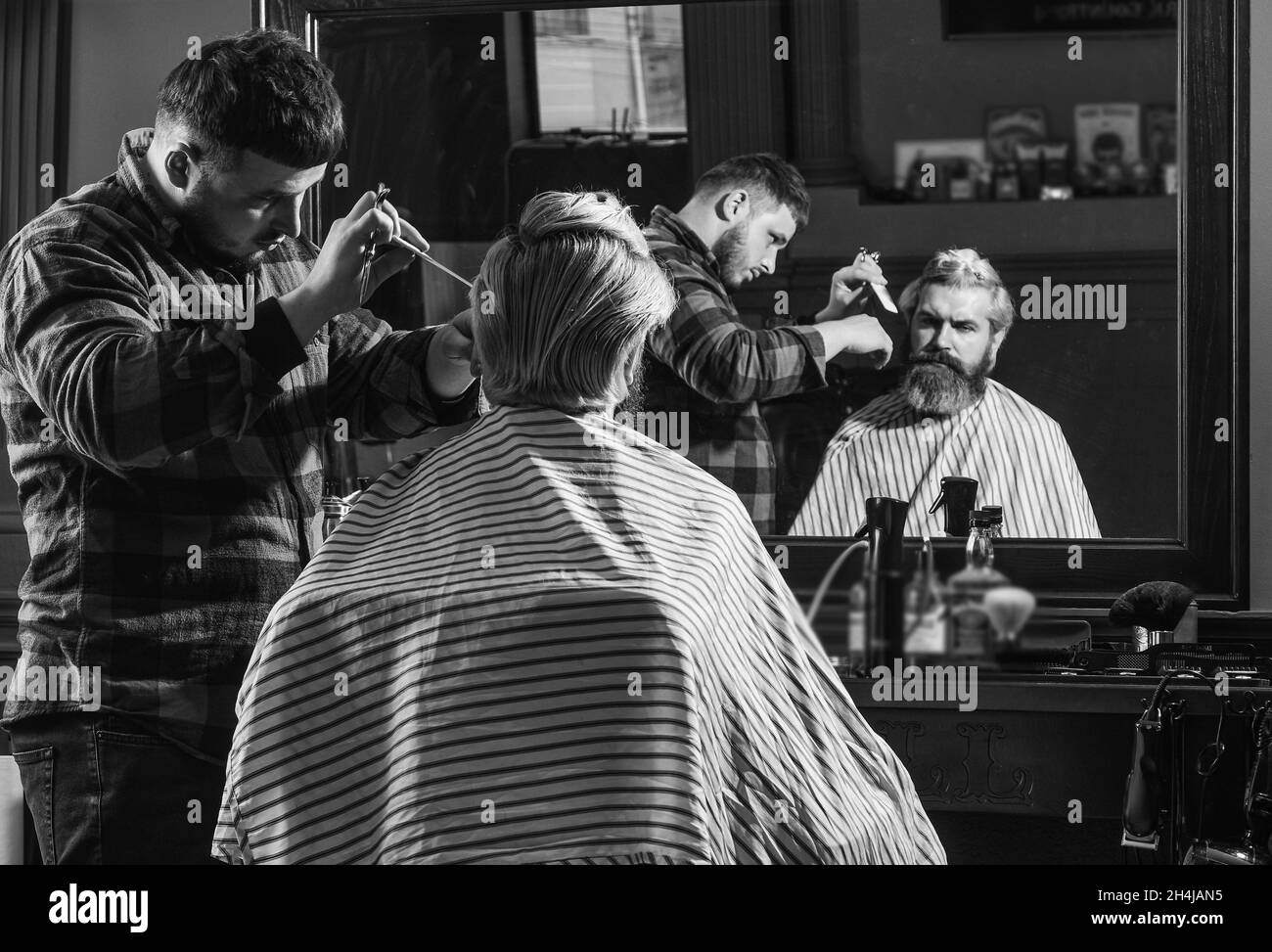 Fashion portrait of man. Barbershop. Young hipster man with beard ...