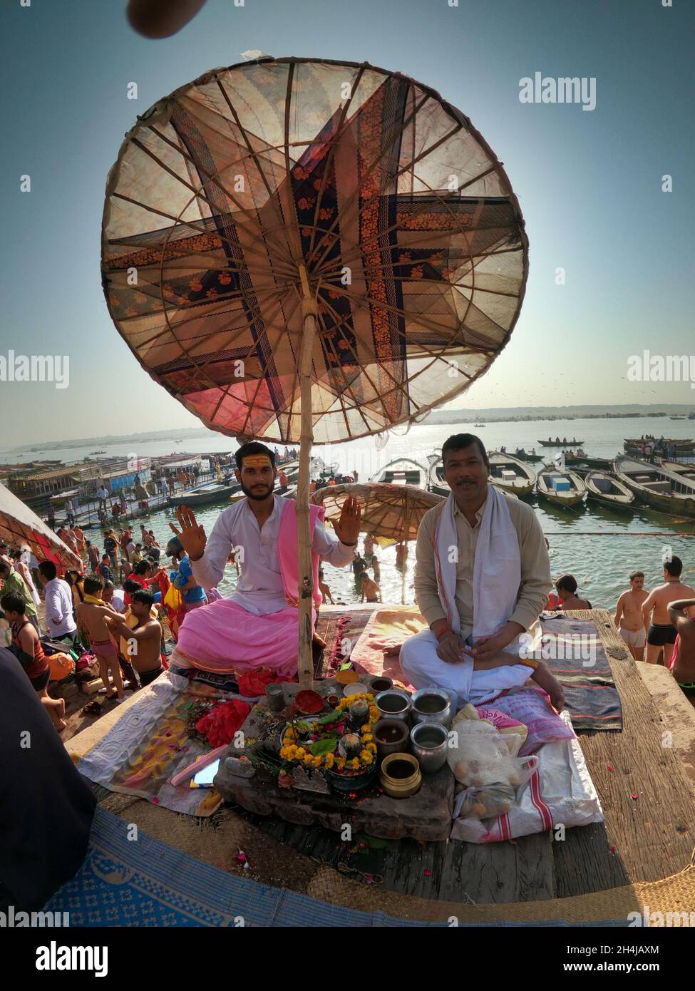 VARANASI, INDIA - Feb 27, 2021: A flipped vertical shot of priests at ...