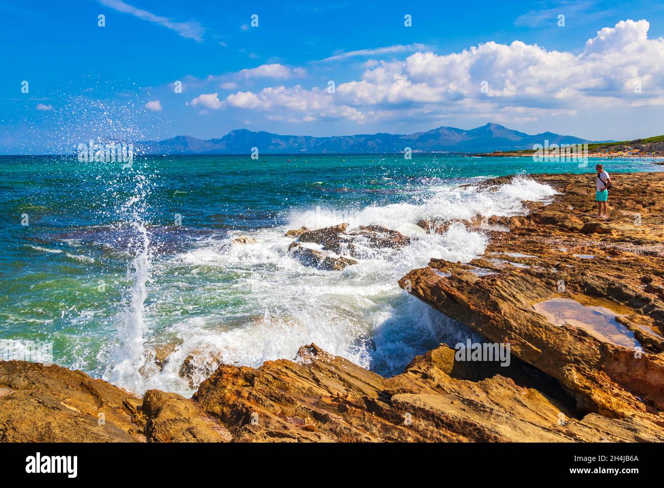 Male traveler and tourist is watching the rough natural coastal and ...