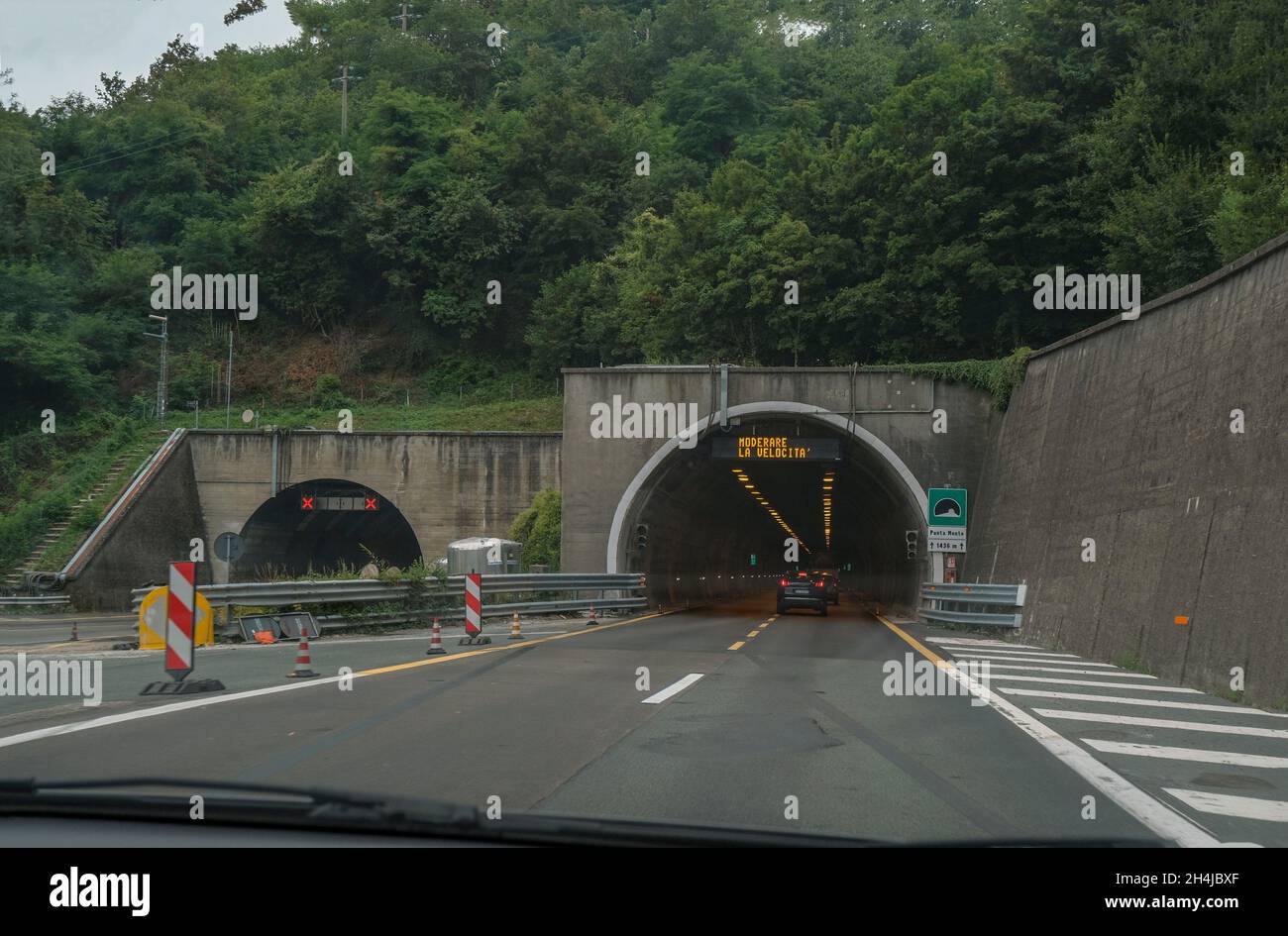 Underground tunnel in the city with cars driving. City infrastructure ...