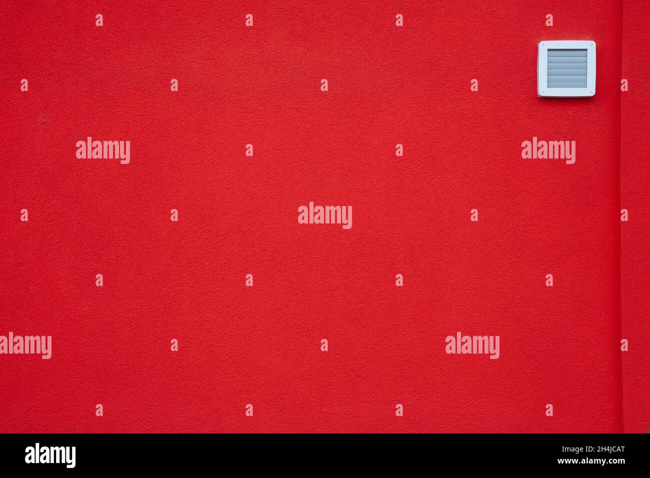 red wall with white fan Stock Photo - Alamy