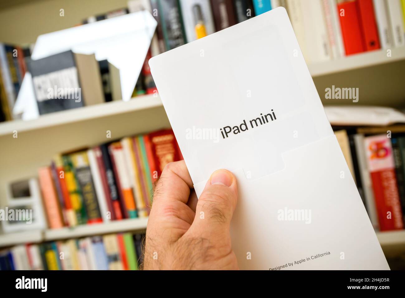 Male hand showing package after unboxing the new Apple Computers iPad ...