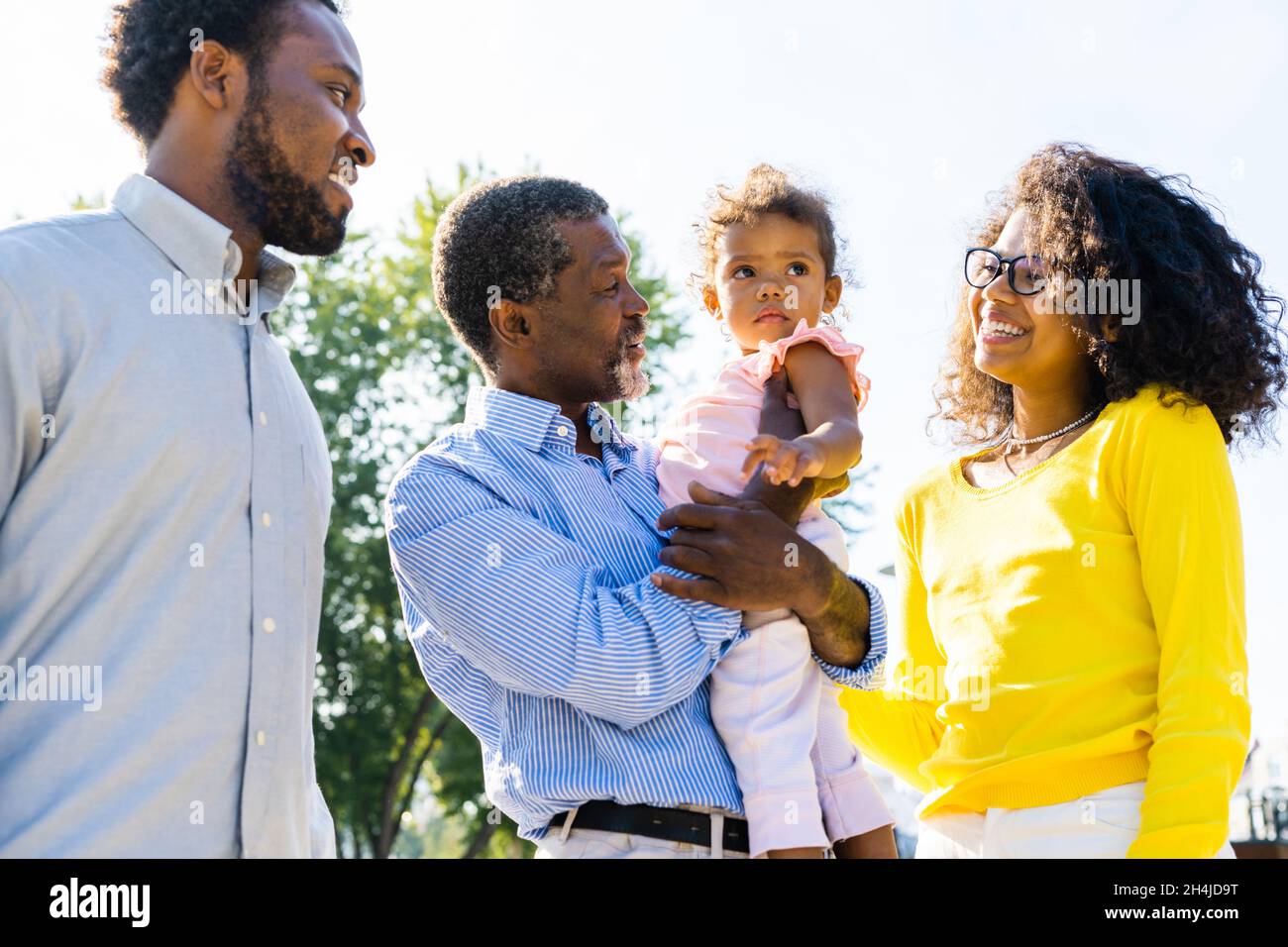 Beautiful happy african american family bonding at the park - Black ...