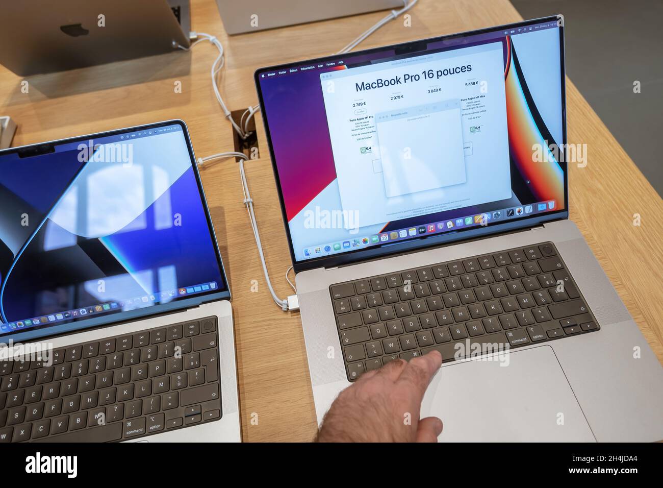 Male hand testing new Apple Computers MacBook book pro 16 inch laptop ...