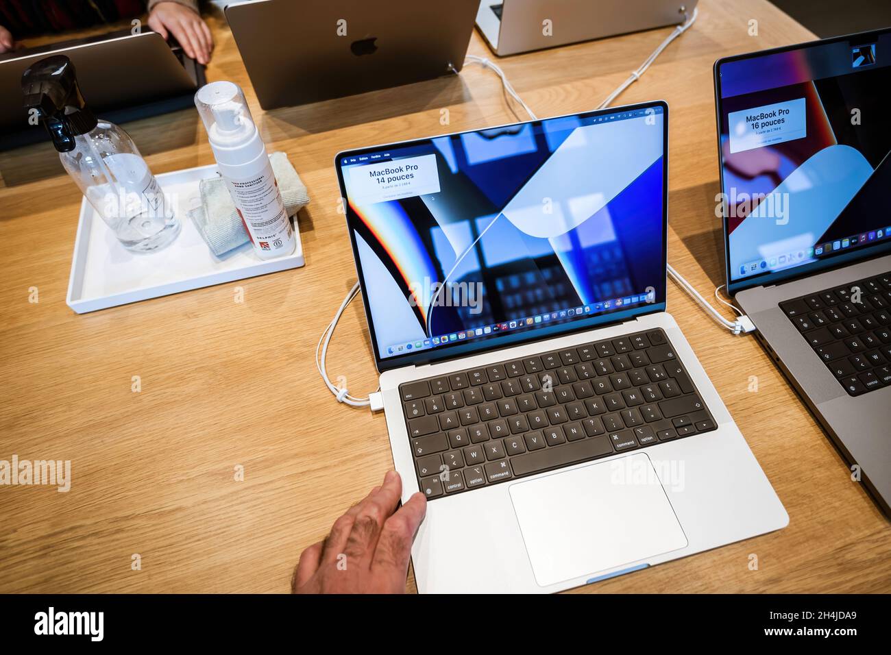 Male hand testing new Apple Computers MacBook book pro 16 inch laptop ...