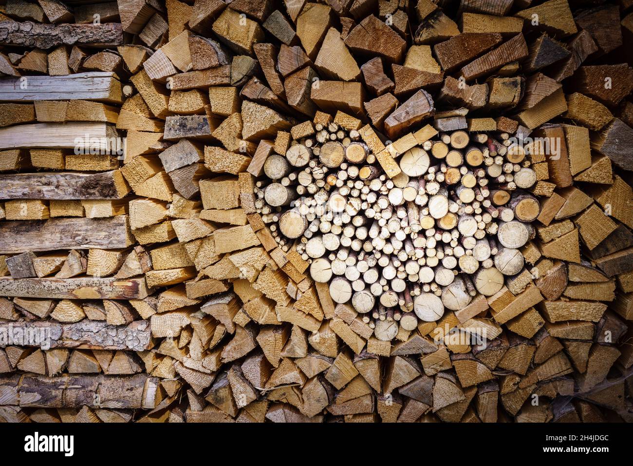 Stacked firewood in the shape of a heart Stock Photo - Alamy