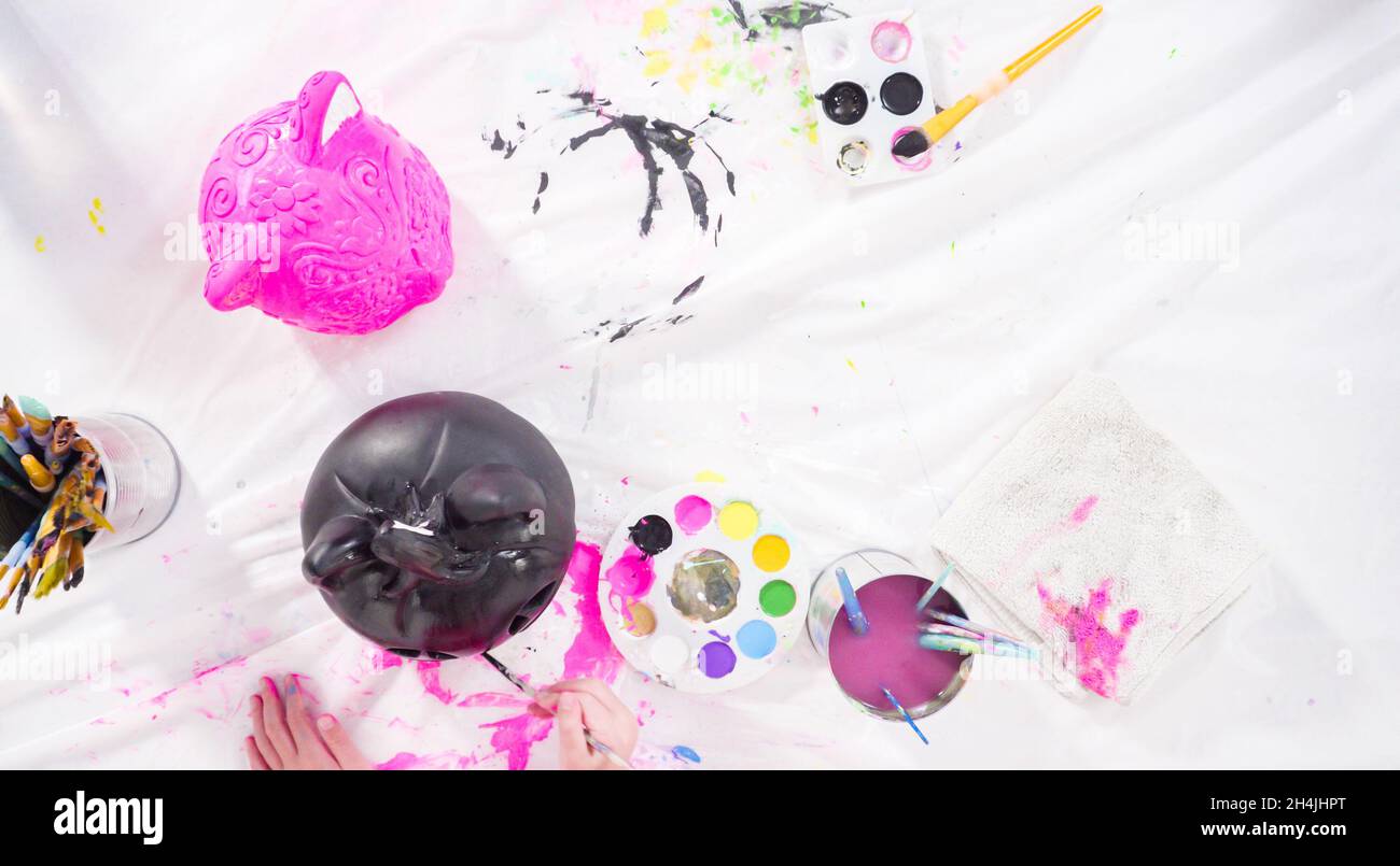 Flat lay. Painting craft pumpkin with acrylic paint for Halloween Stock ...