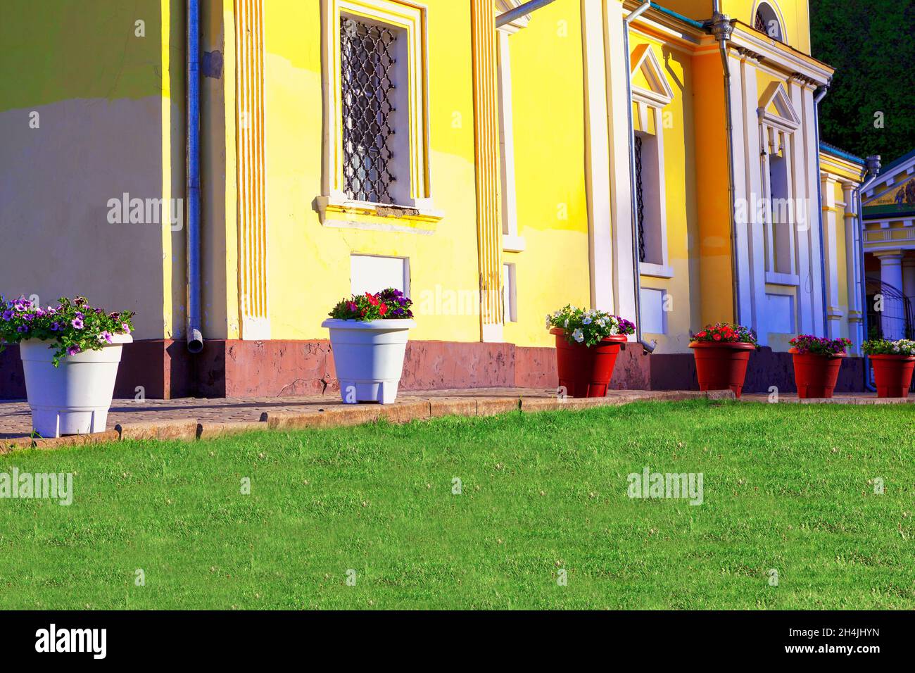 Flower pots near architecture base . Flowerpots and lawn Stock Photo ...