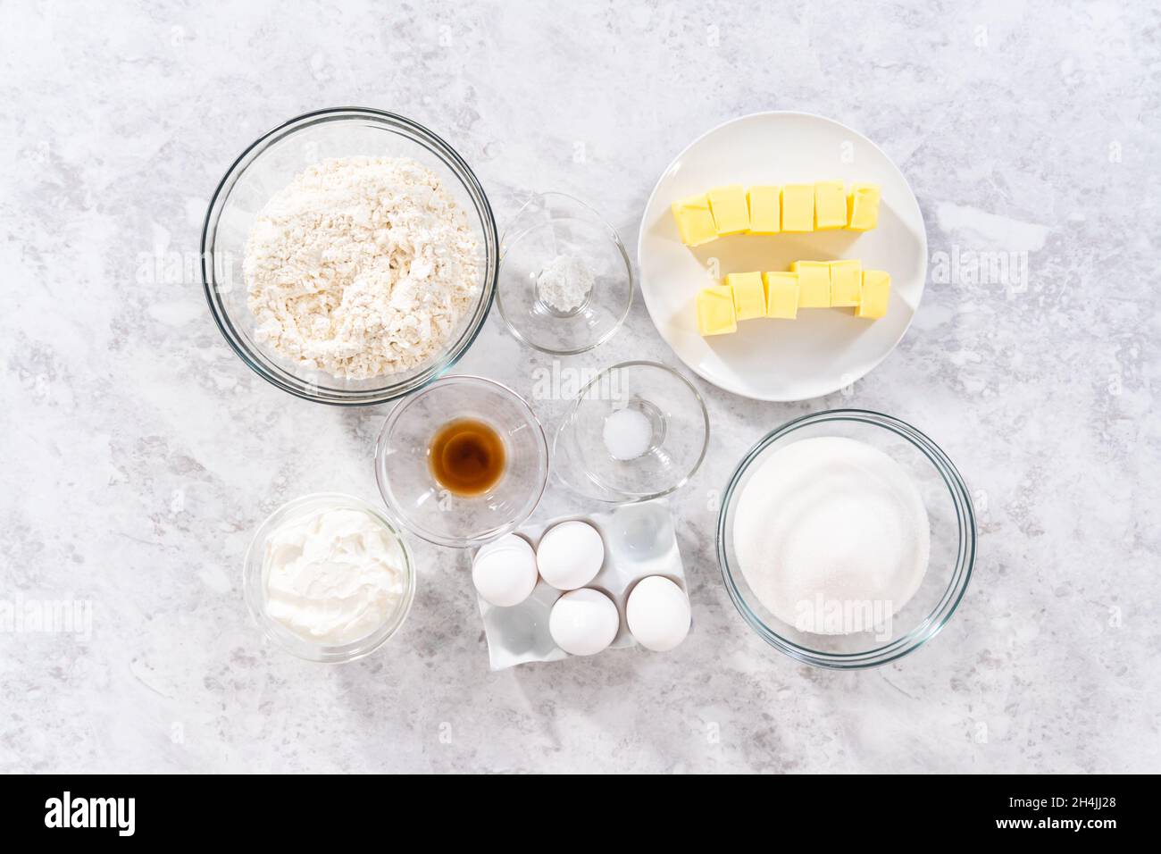 Flat lay. Ingredients in glass mixing bowls to bake July 4th bundt cake ...