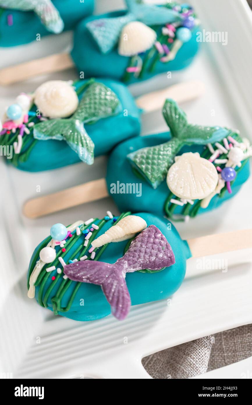 Mermaid cakesicles with drizzled chocolate, chocolate mermaid tails ...