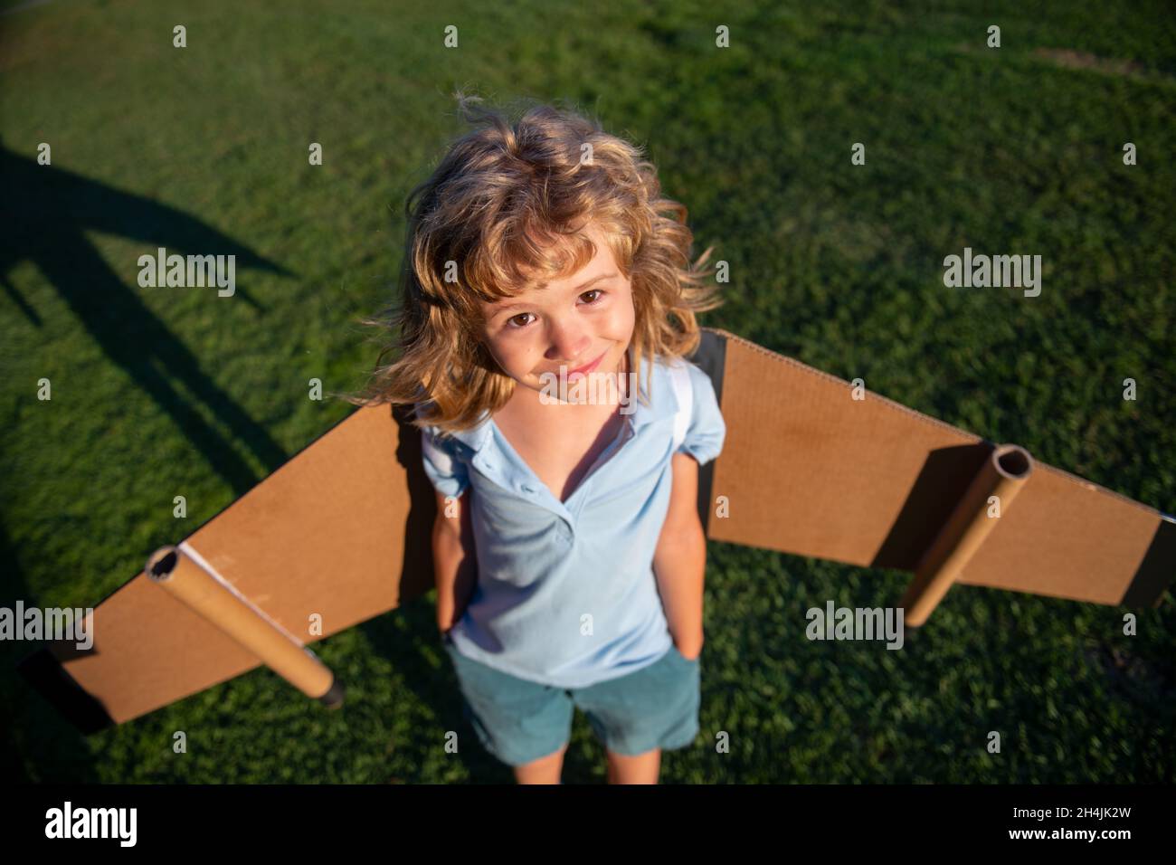 Funny child boy playing with toy jetpack. Child pilot astronaut or ...