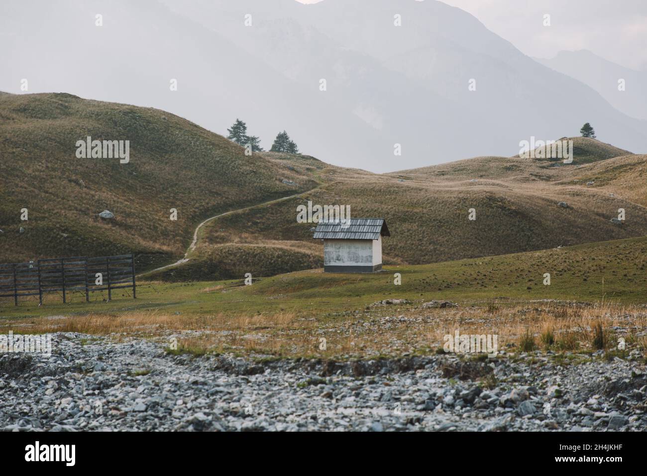 Beautiful view of a trail through green hills and mountains in Col de ...