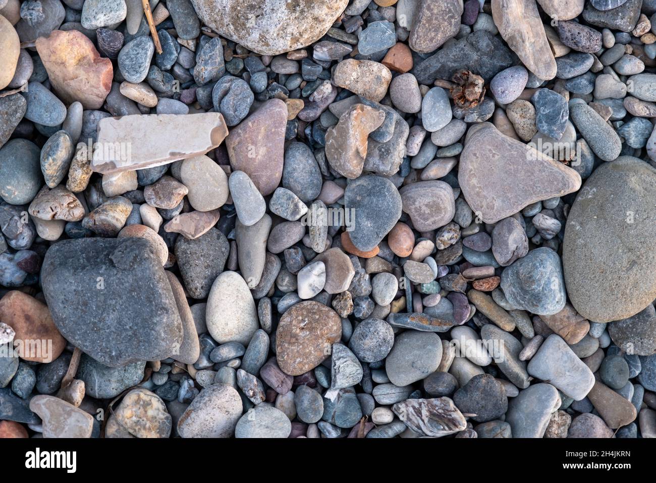 top view photo of pebbles and stones on the beach Stock Photo - Alamy
