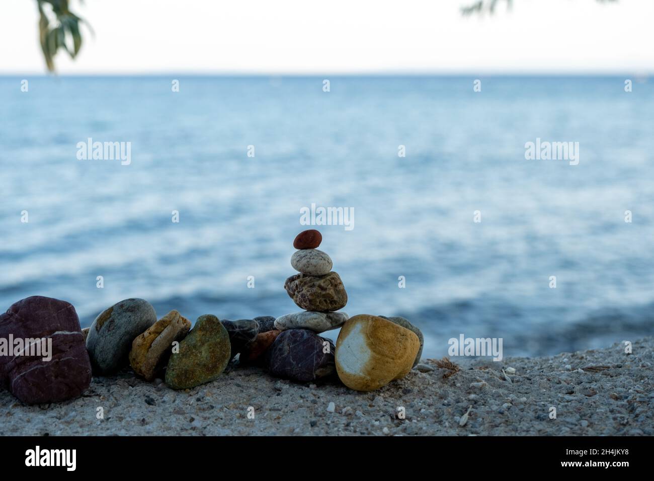 decorated stones side by side near the beach Stock Photo - Alamy