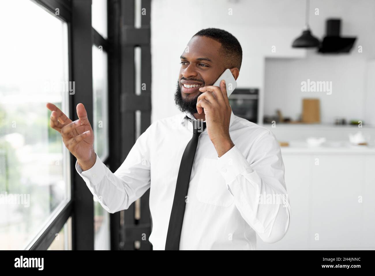 Mobile Call. Smiling African American Guy In White Shirt Talking On ...