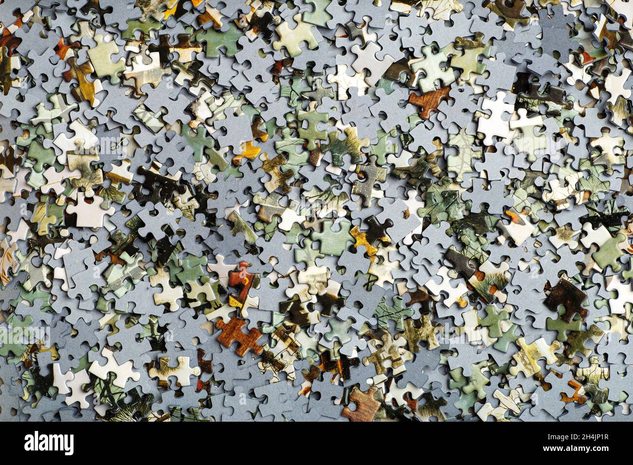 Paper head with puzzle pieces on a blue background. Board games for ...