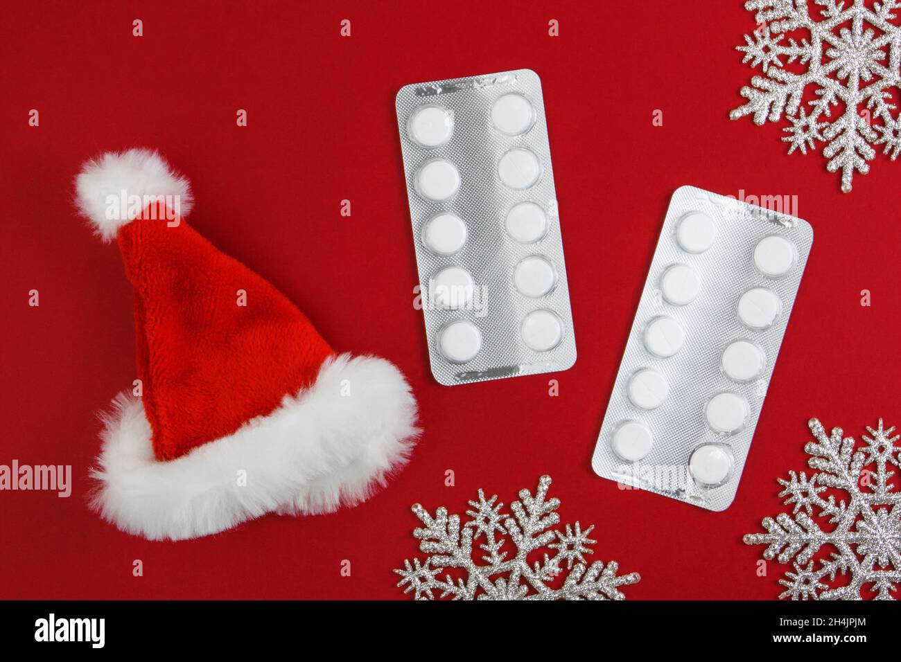 Medical Christmas background. Pills, blister and santa claus hat,on a ...