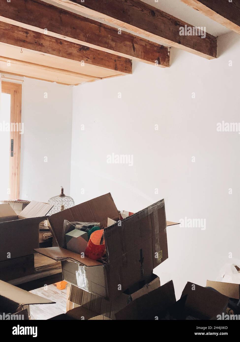 Open moving boxes in a new house Stock Photo - Alamy