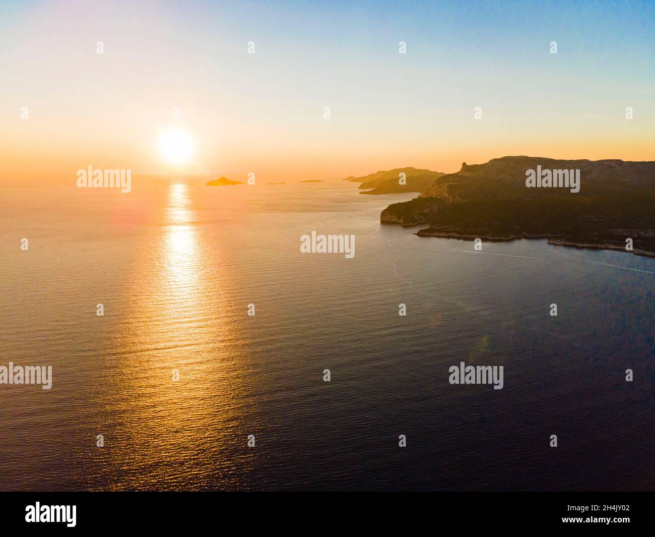 France, Bouches du Rhone, Calanques National Park, sunset over the bay ...