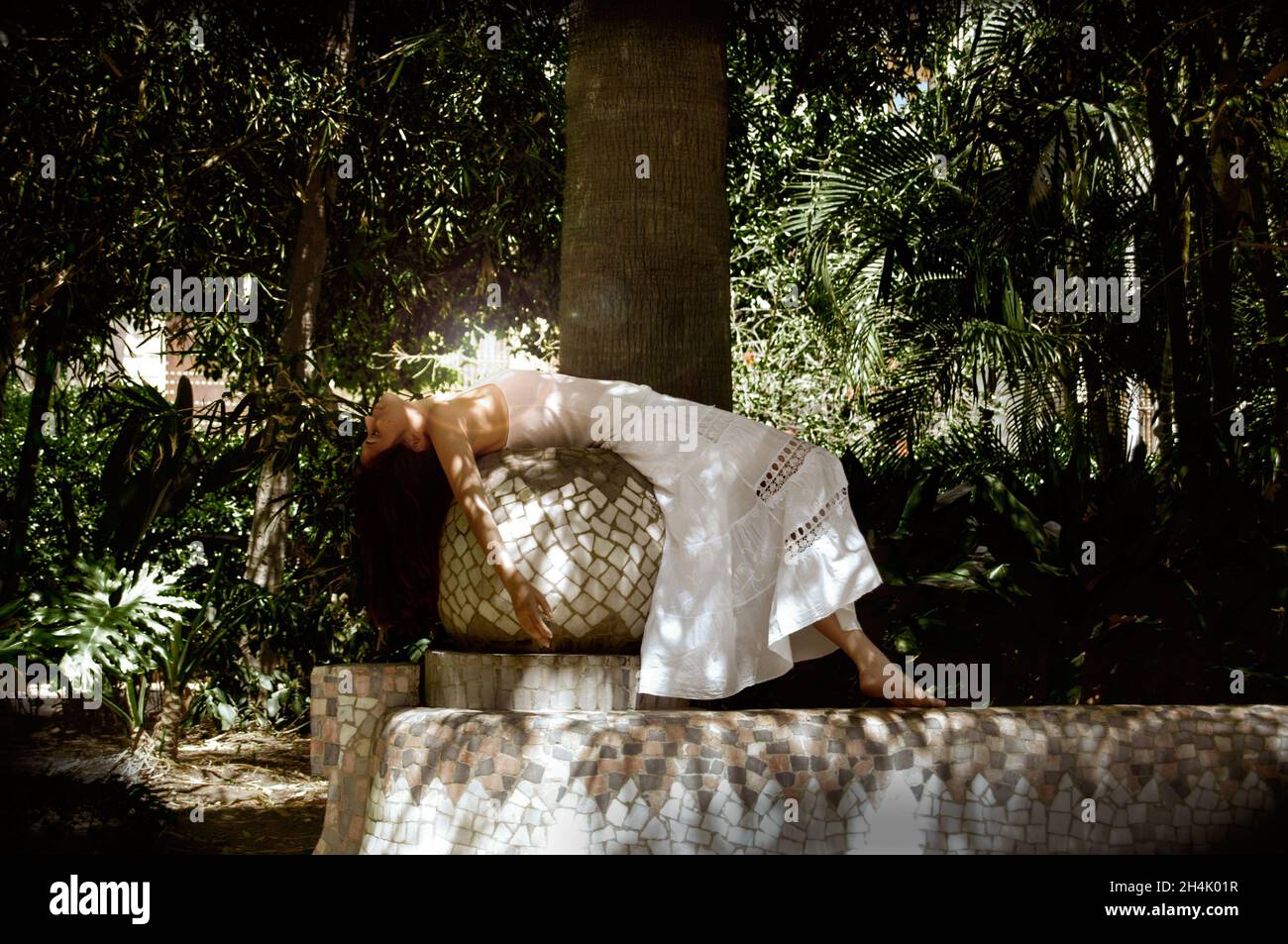 Woman lying on a wall hi-res stock photography and images - Alamy