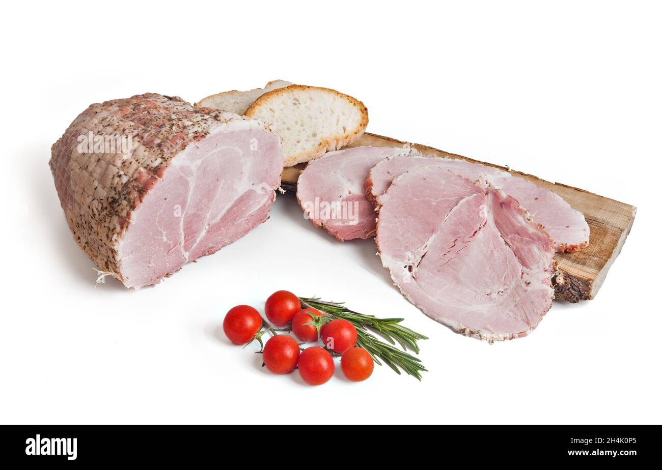 italian roasted ham sliced on a cutting board on white background with ...