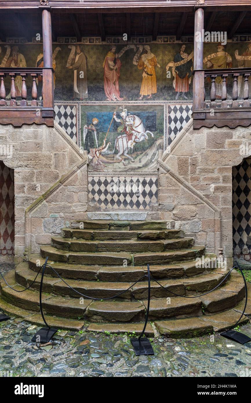 interior of the fenis castle with a beautiful painting of San Giorgio ...