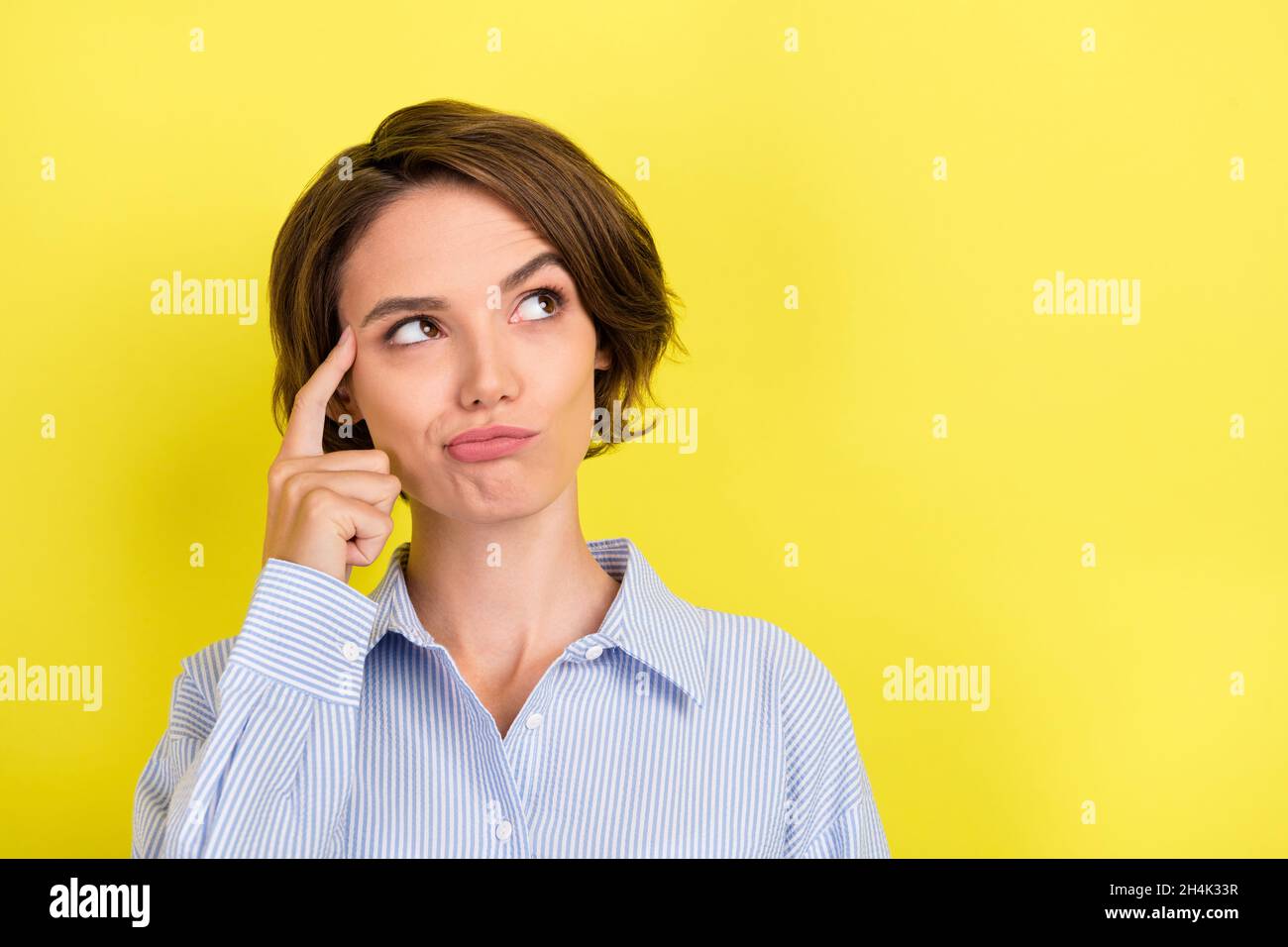 Photo of young attractive woman finger touch head think memory idea ...