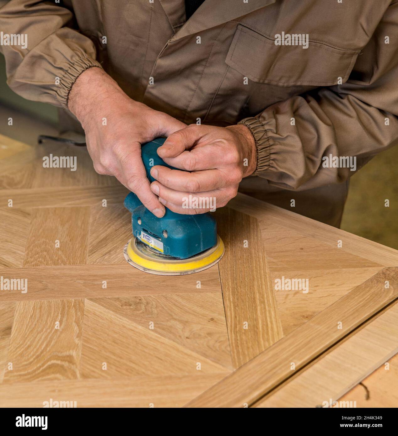 close up of carpenter's hand using a grinder on a wood surface Stock ...