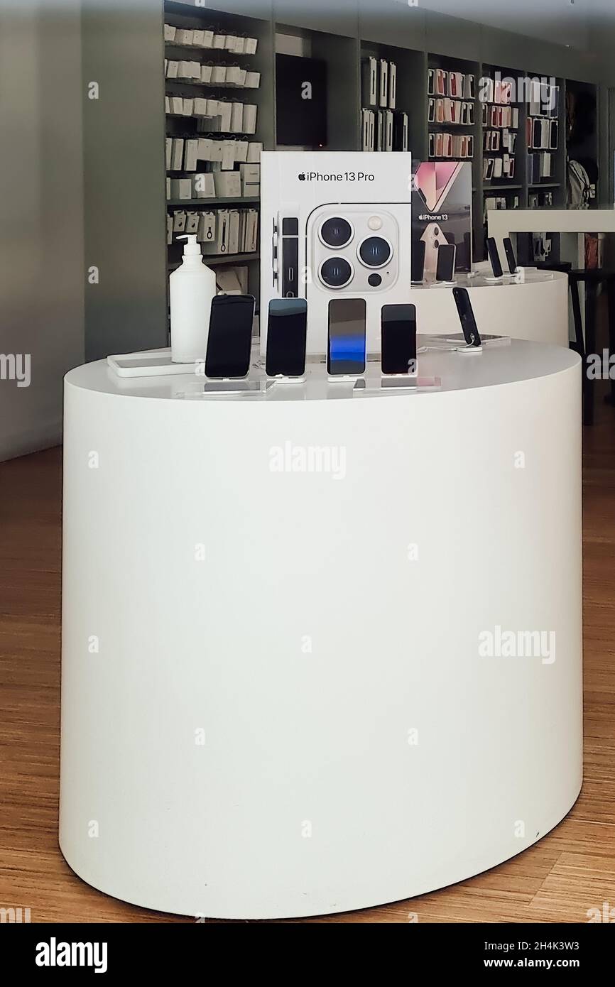 Apple store exterior view with iPhone 13 Pro on display. Looking ...