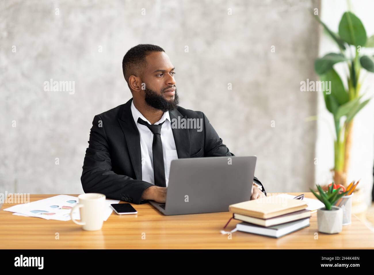 Portrait Of Pensive African American Business Man Sitting At Desk With ...