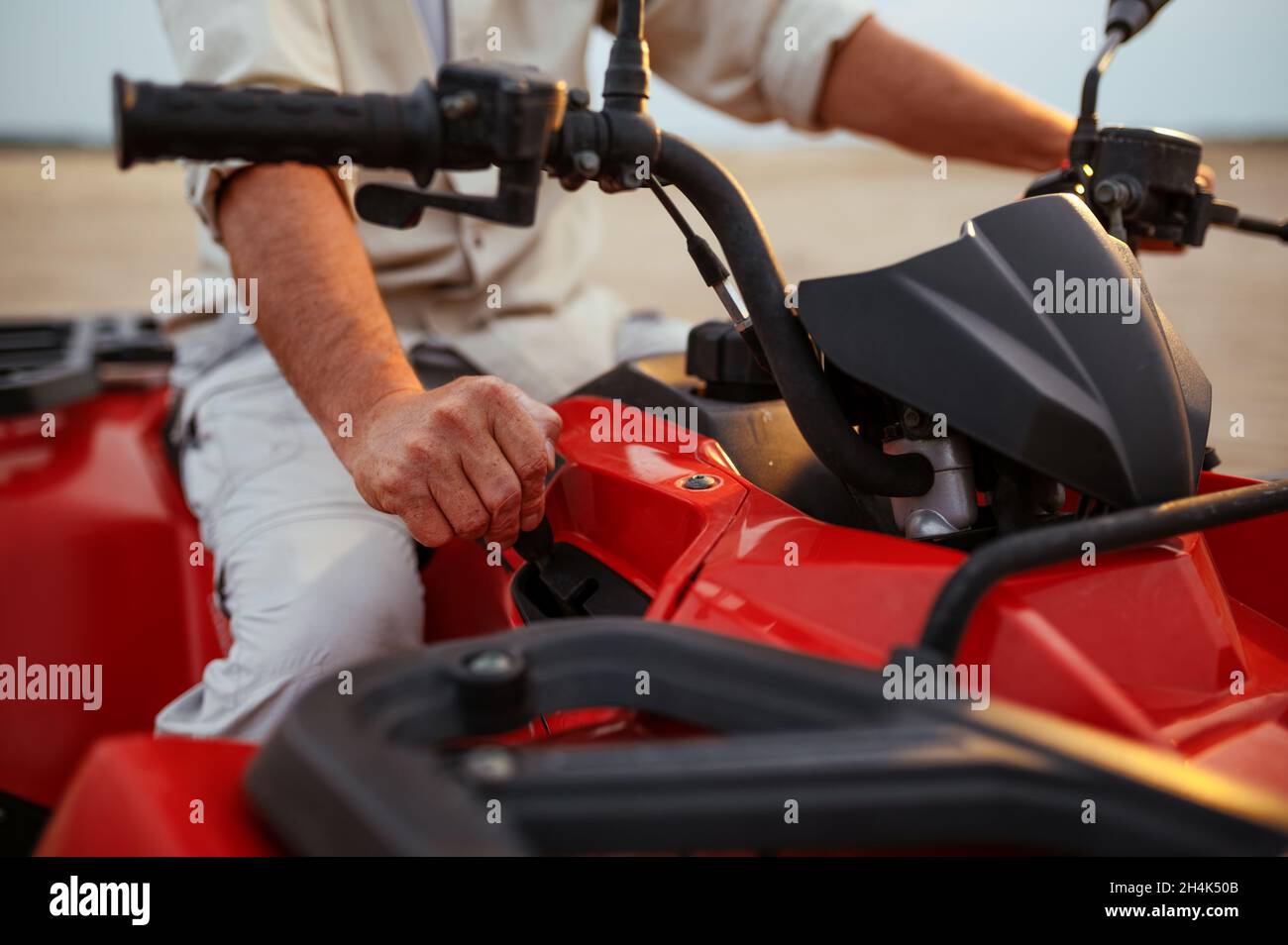 Atv racer in desert, closeup front view on hands Stock Photo - Alamy