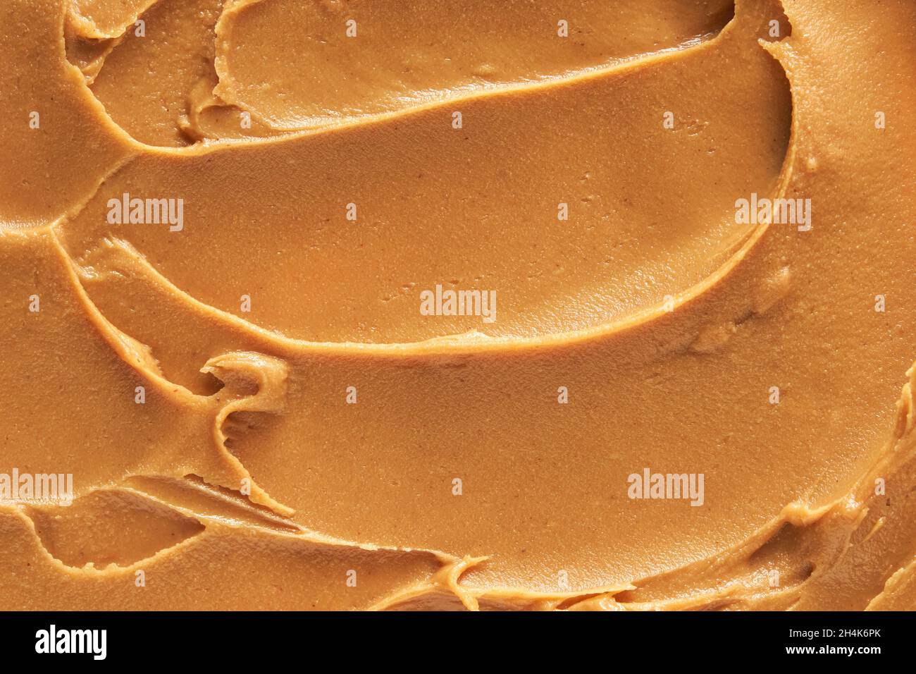 Peanut butter texture. Spread swirl. Organic keto food Stock Photo - Alamy