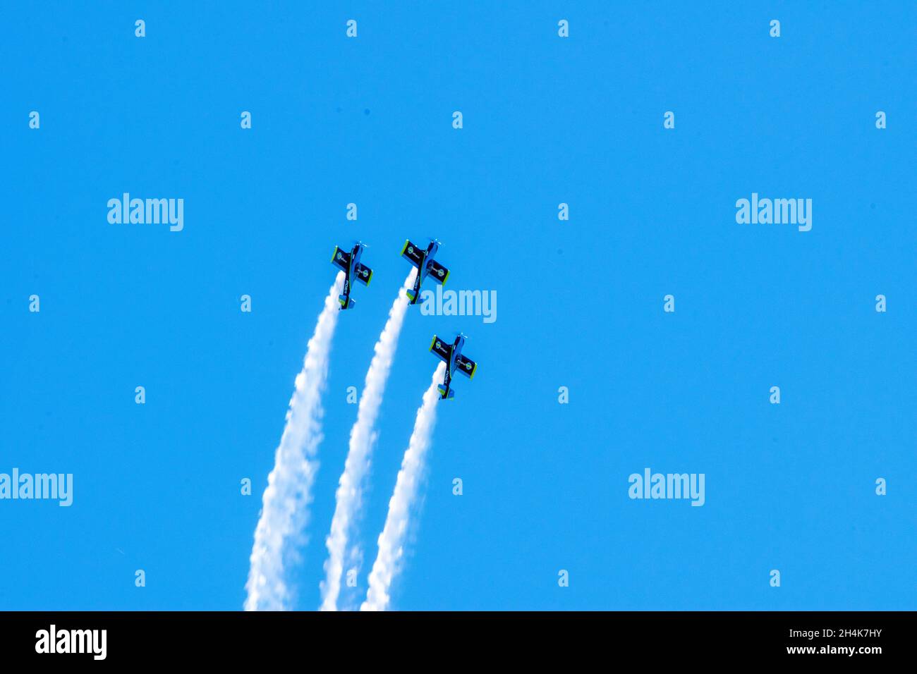 Group of flying aircraft against a blue sky during an airshow Stock ...