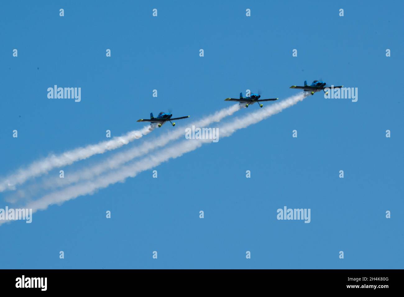 Group of flying aircraft against a blue sky during an airshow Stock ...