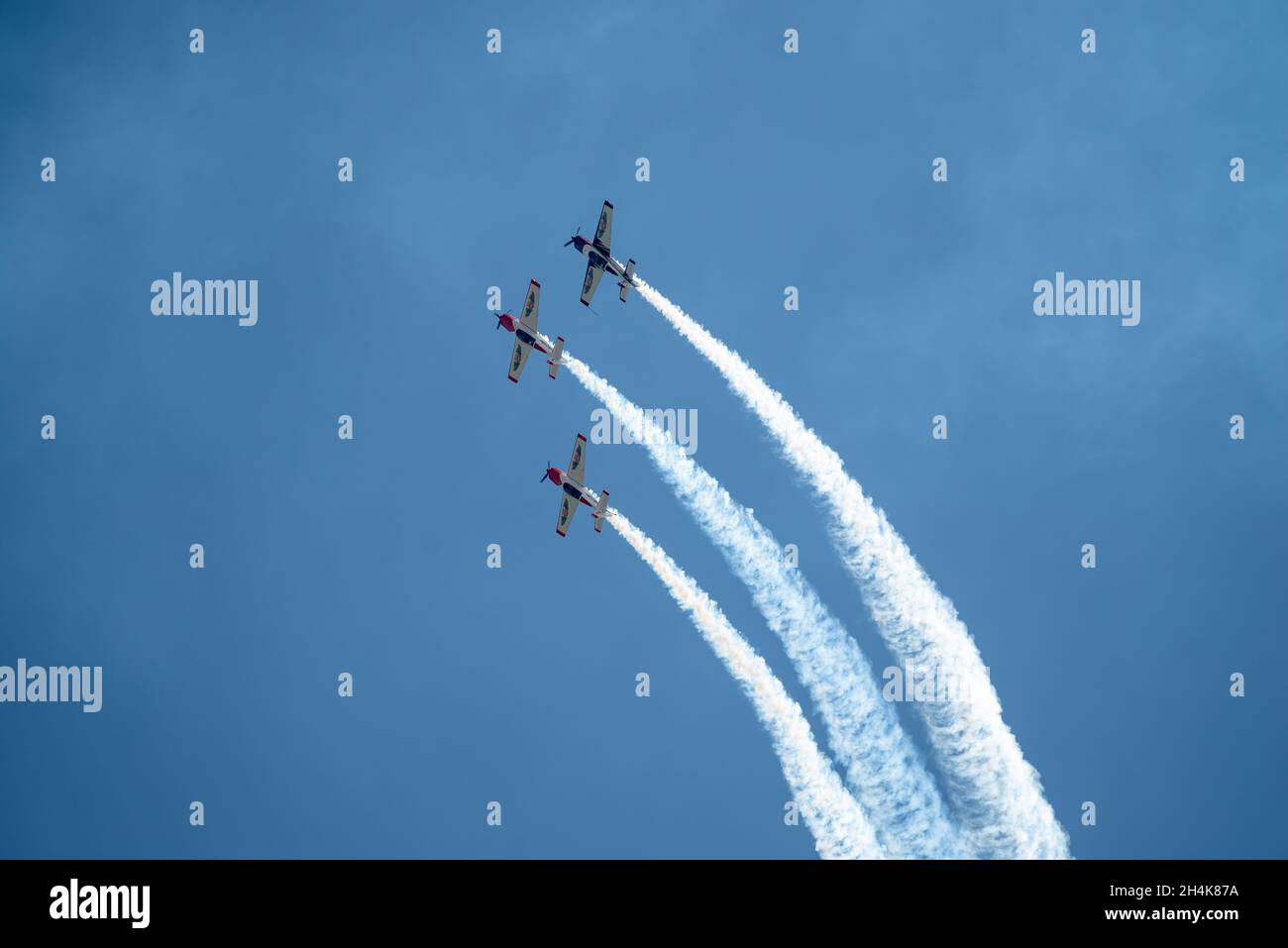 Group of flying aircraft against a blue sky during an airshow Stock ...