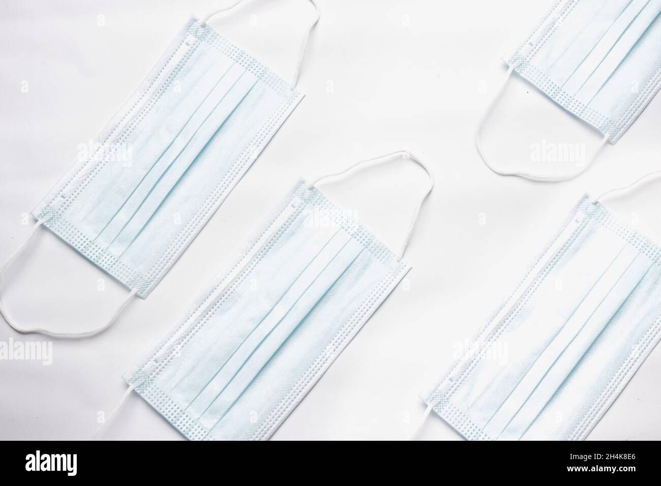 four medical masks, blue masks Stock Photo - Alamy