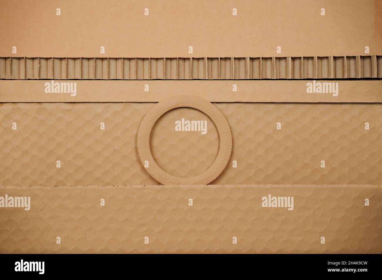 textured recycled cardboard background pattern with circle Stock Photo ...
