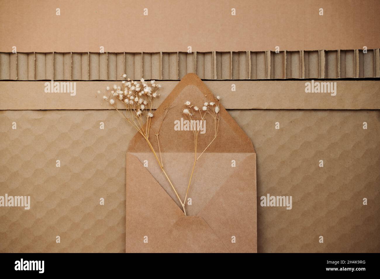 textured recycled cardboard background pattern with brown paper ...