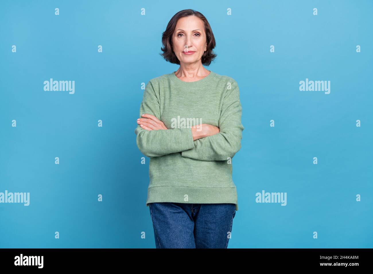 Photo of elder grey hair bossy woman crossed palms wear green pullover ...