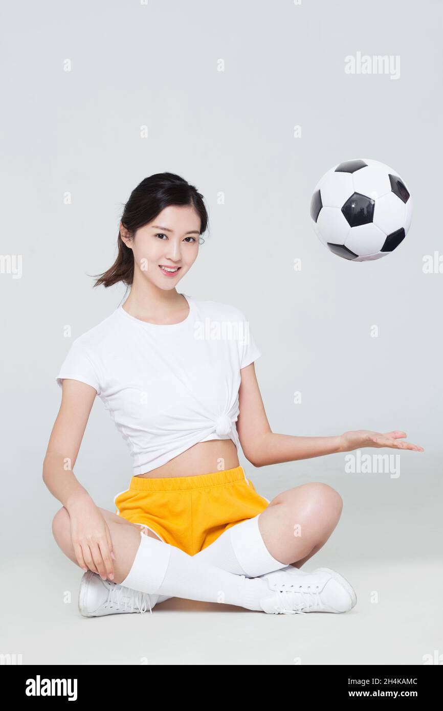 Happy and beautiful football baby Stock Photo - Alamy