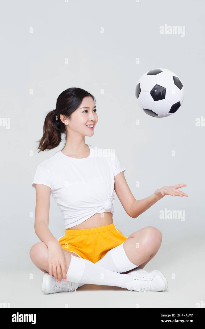Happy and beautiful football baby Stock Photo - Alamy