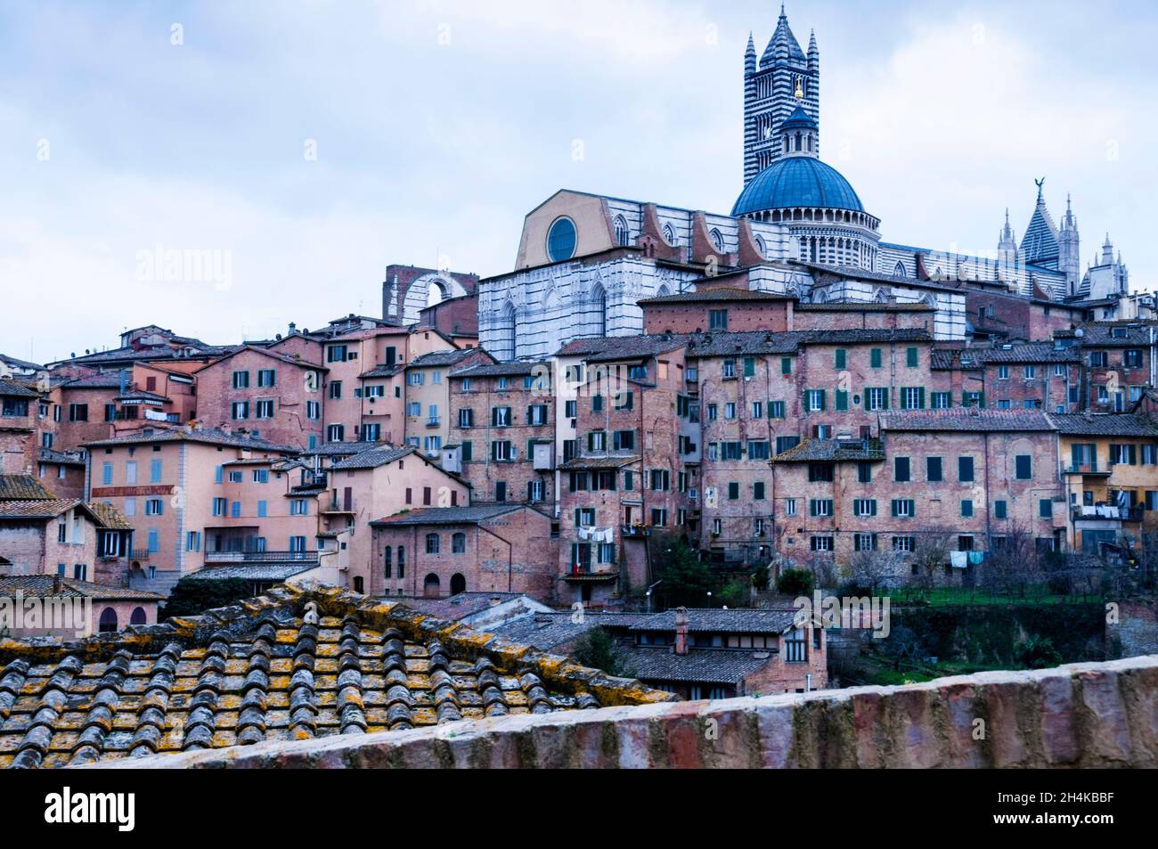 Striped bell tower and dome of medieval Siena Cathedral in Siena, Italy ...