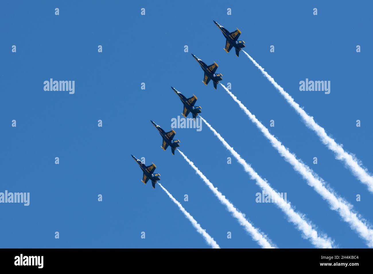 Group of flying aircraft against a blue sky during an airshow Stock ...