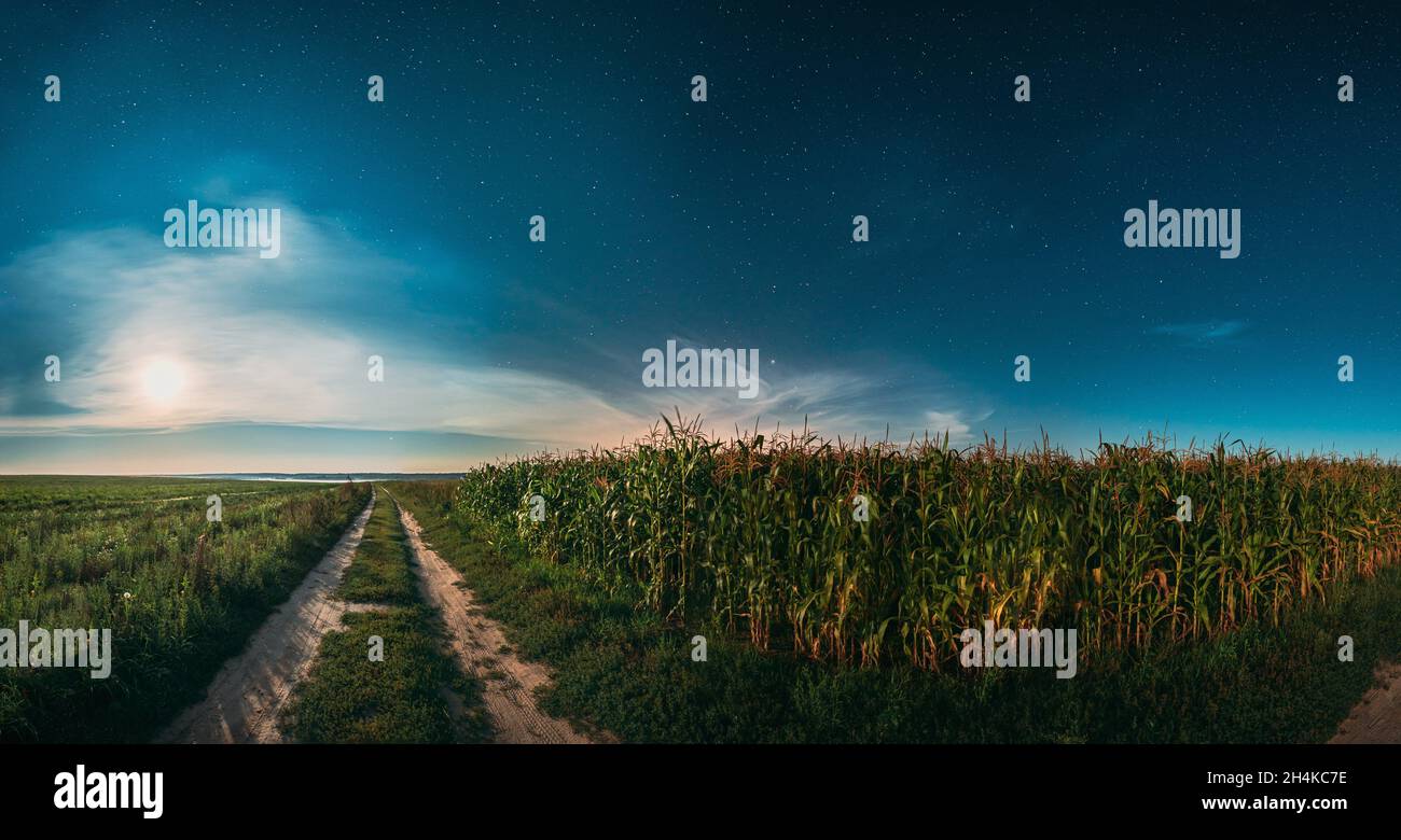Moon In Night Starry Sky Above Landscape With Rural Country Road ...