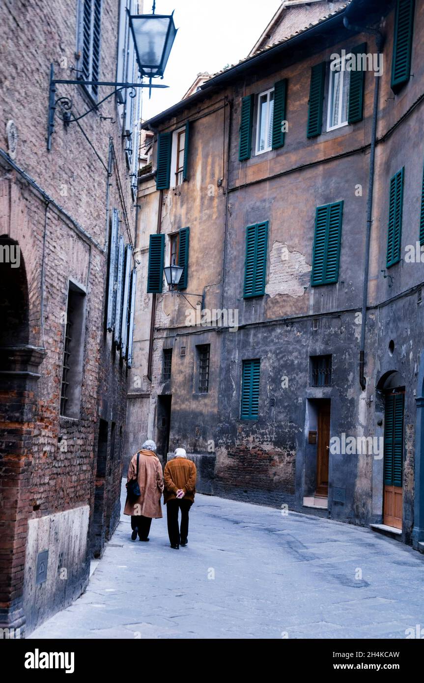 La passeggiata or the art of taking a walk in Siena, Italy Stock Photo ...