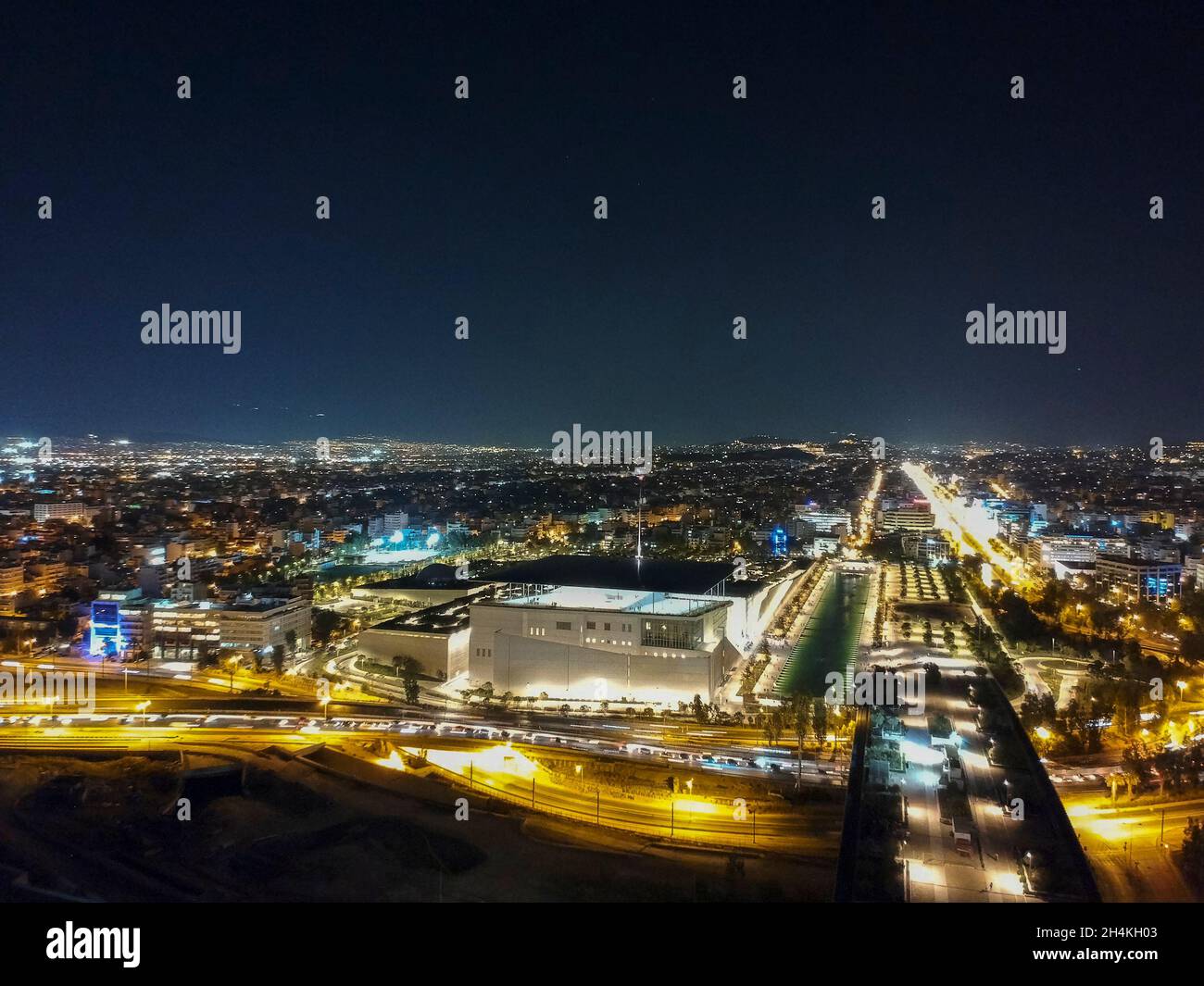 Aerial cityscape view of southern Athens at night. Centered the ...
